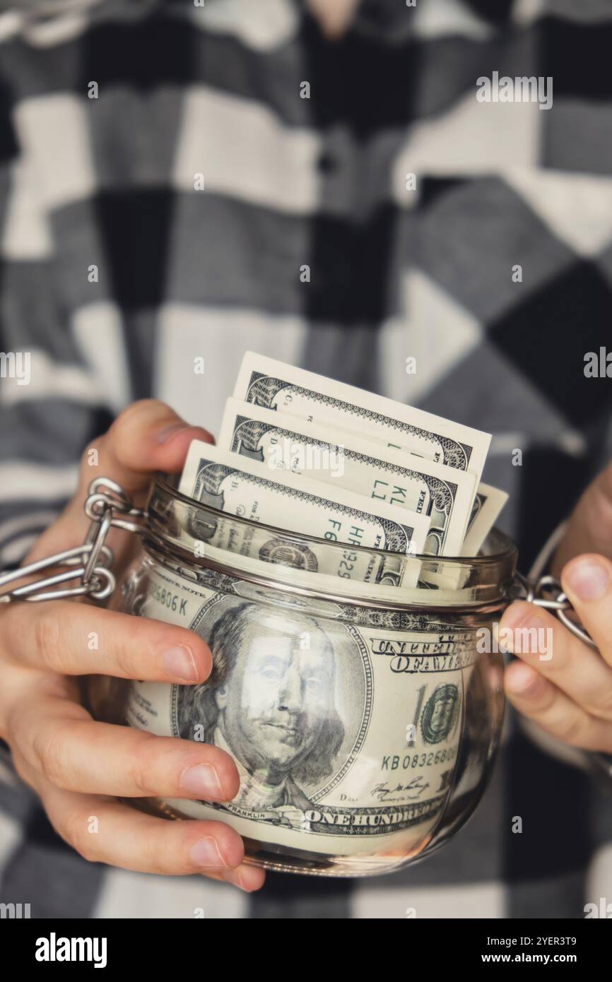 Dollar banknote saving money in glass jar. Unrecognizable woman ...