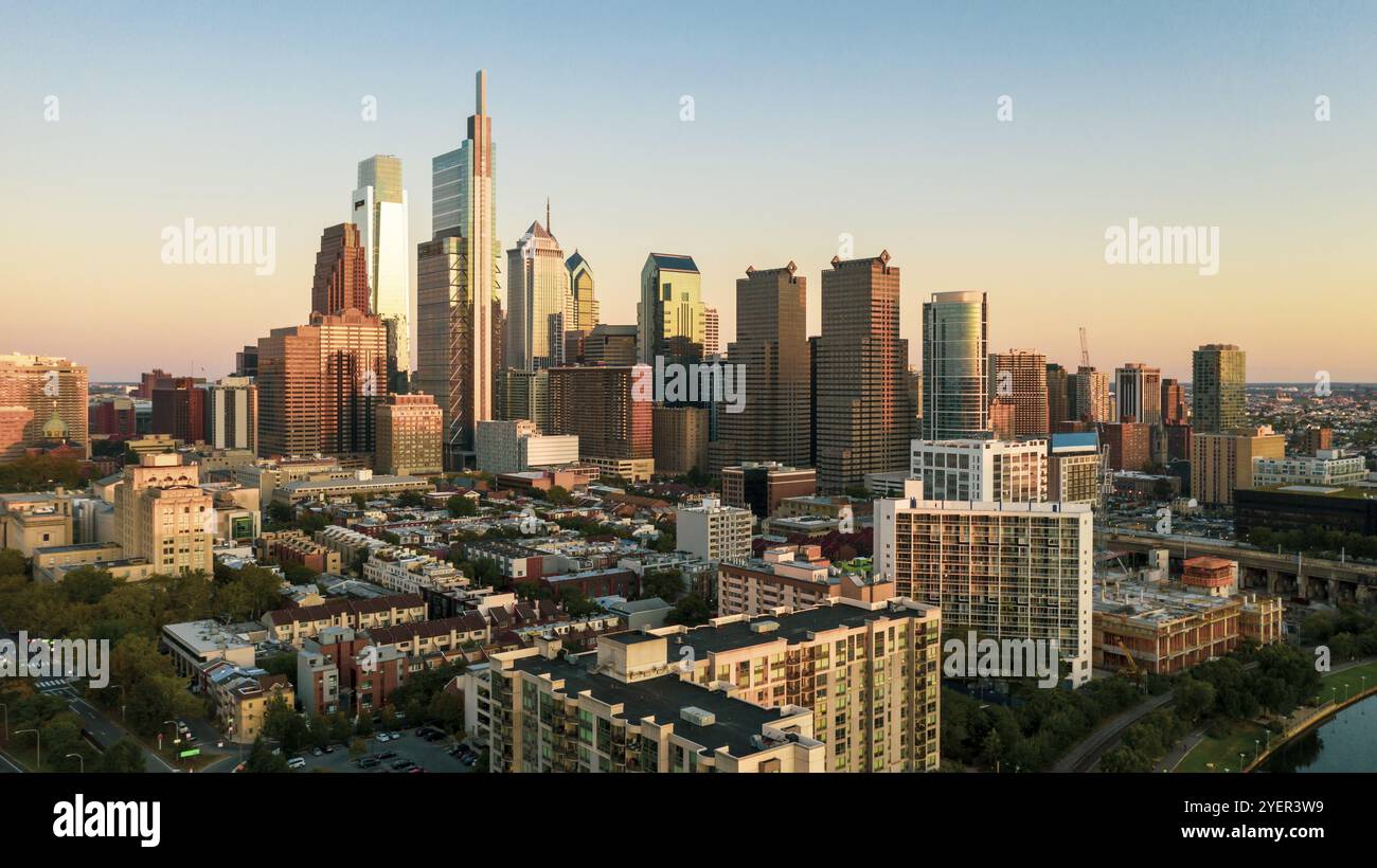 The tall buildings reflect saturated sunset light in the glass in this ...