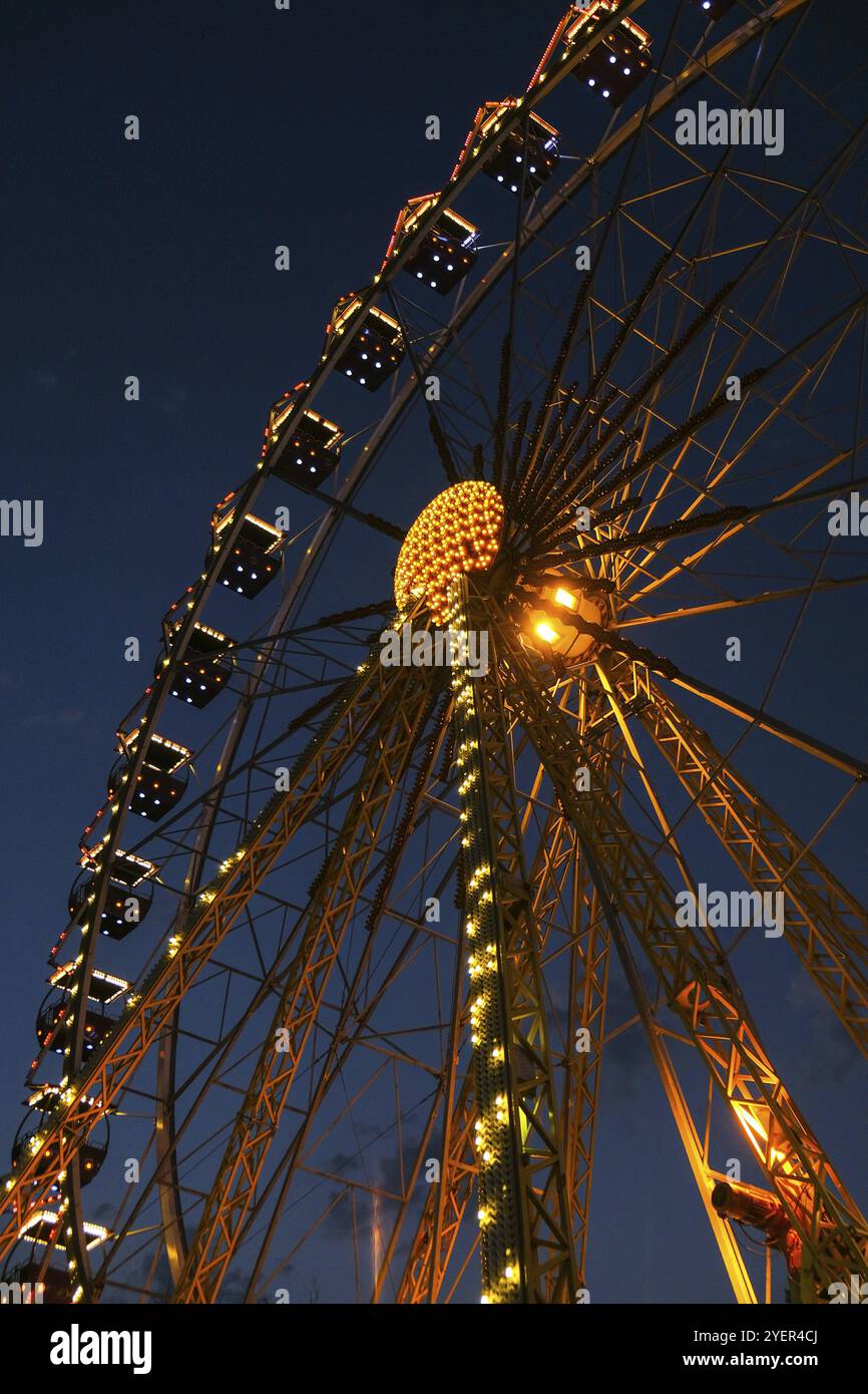 Ferris Wheel Lights at Night. Neon colored lights flashing on the ...