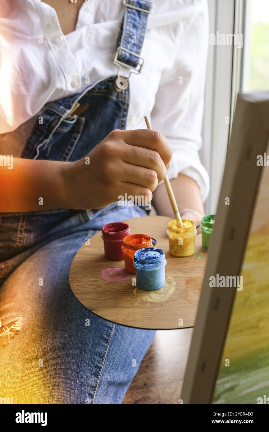 Creative painter in working process. Artist workplace, hobby, craft ...