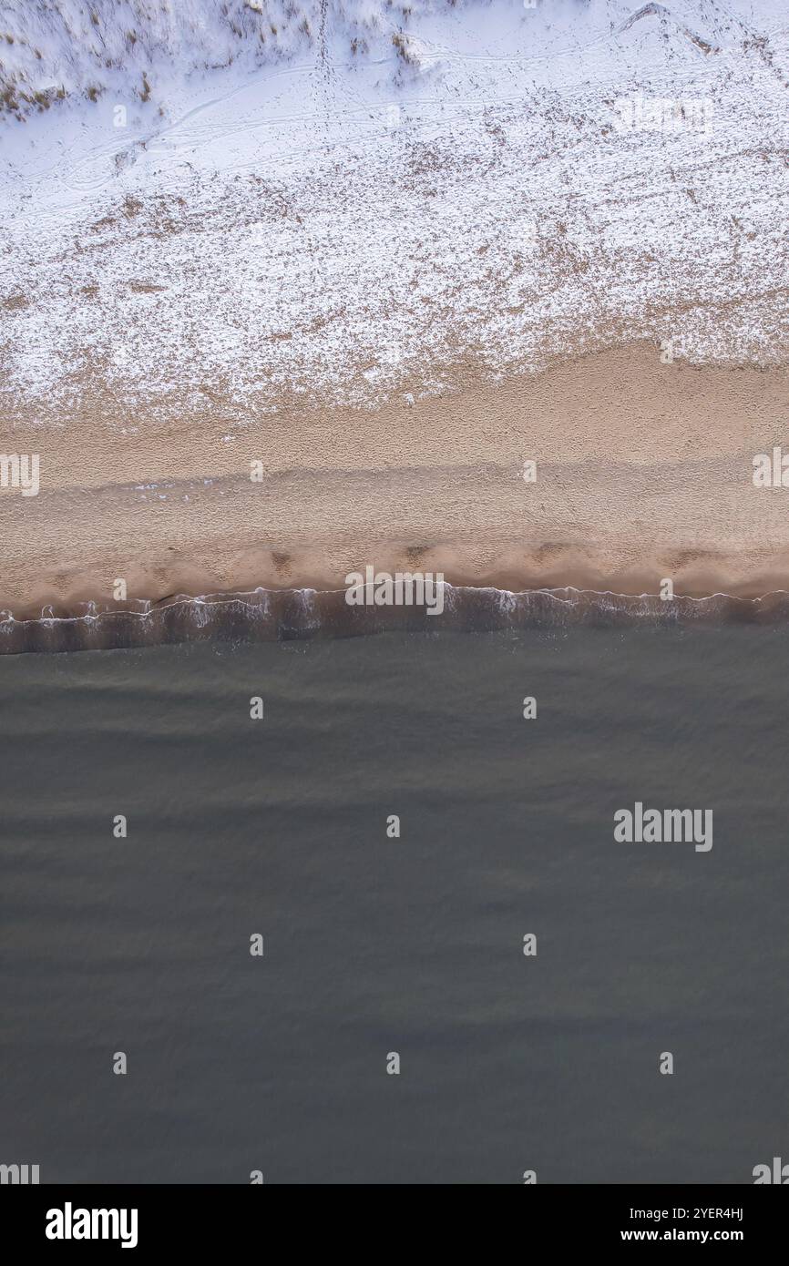 Winter in cold Baltic sea snowy beach in Gdansk. Aerial view of snow ...