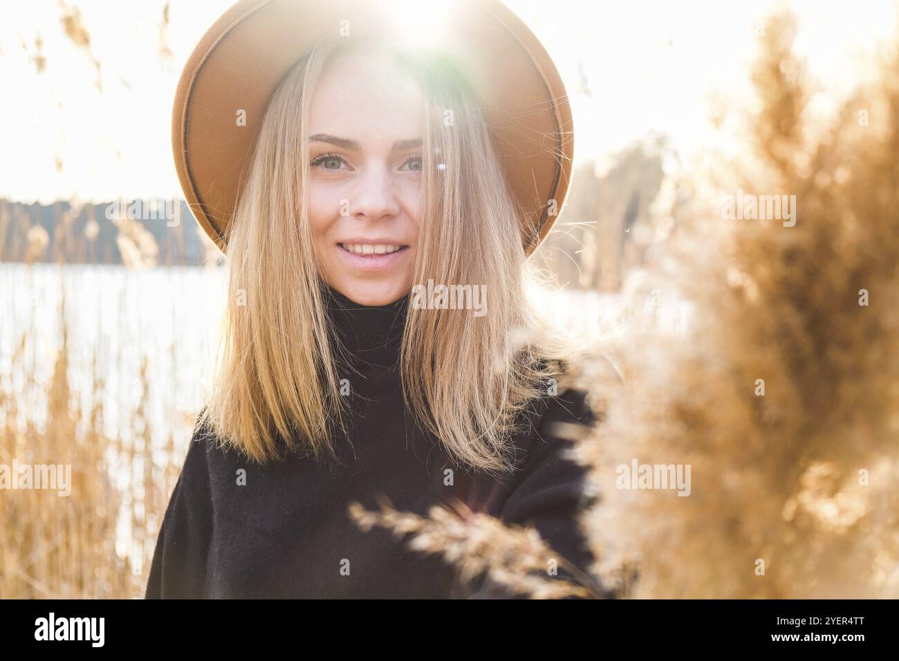 European blonde woman with beige hat in black sweater in the ...