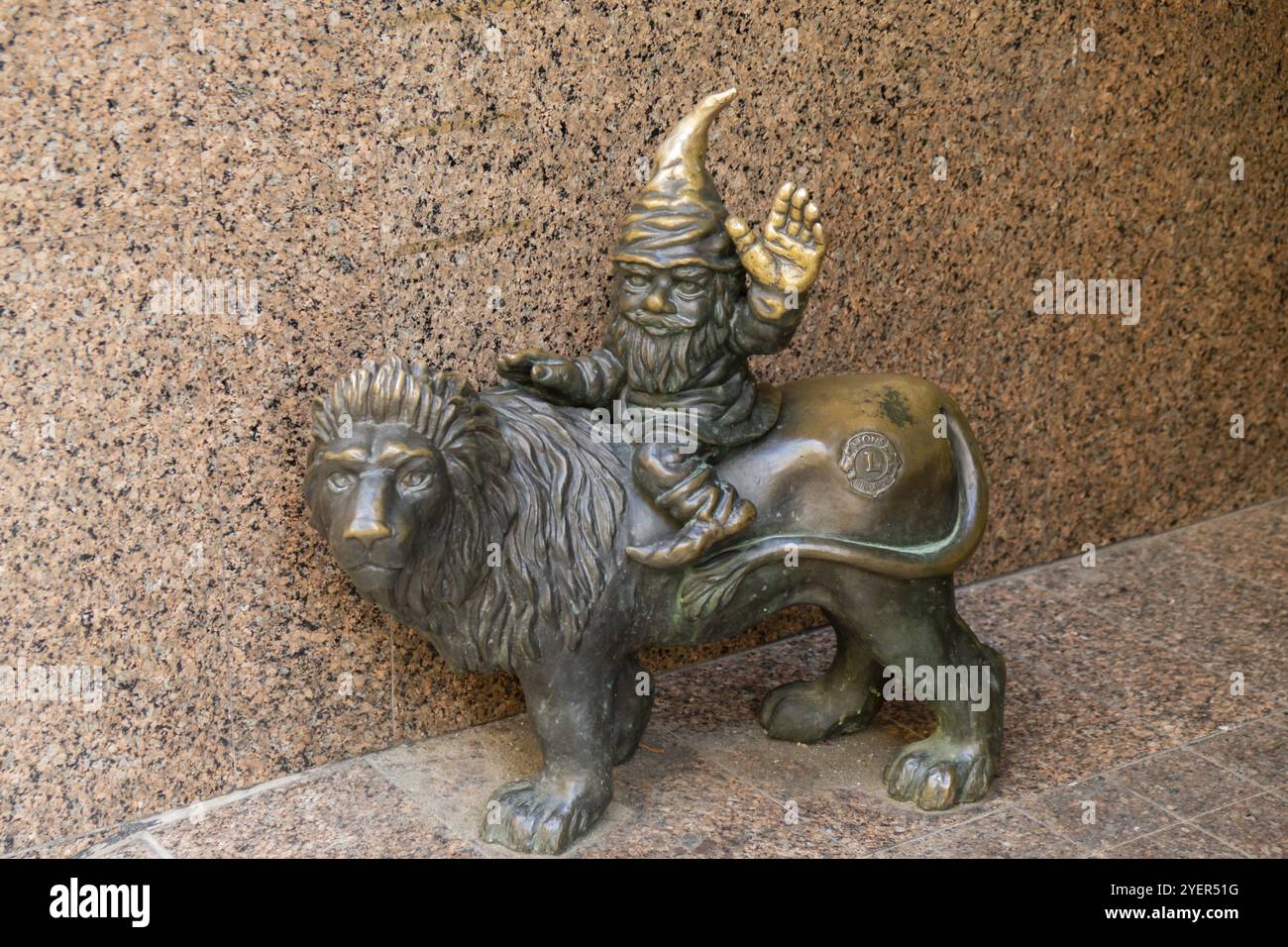 Dwarf riding a lion sleeping cap sitting on a lion and waving hello ...