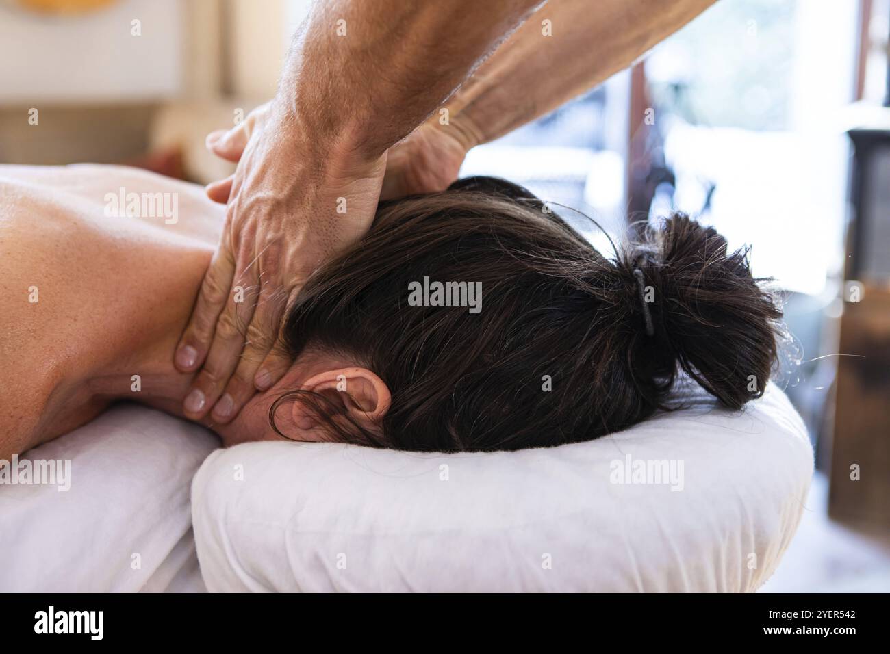Therapist giving professional neck hi-res stock photography and images ...