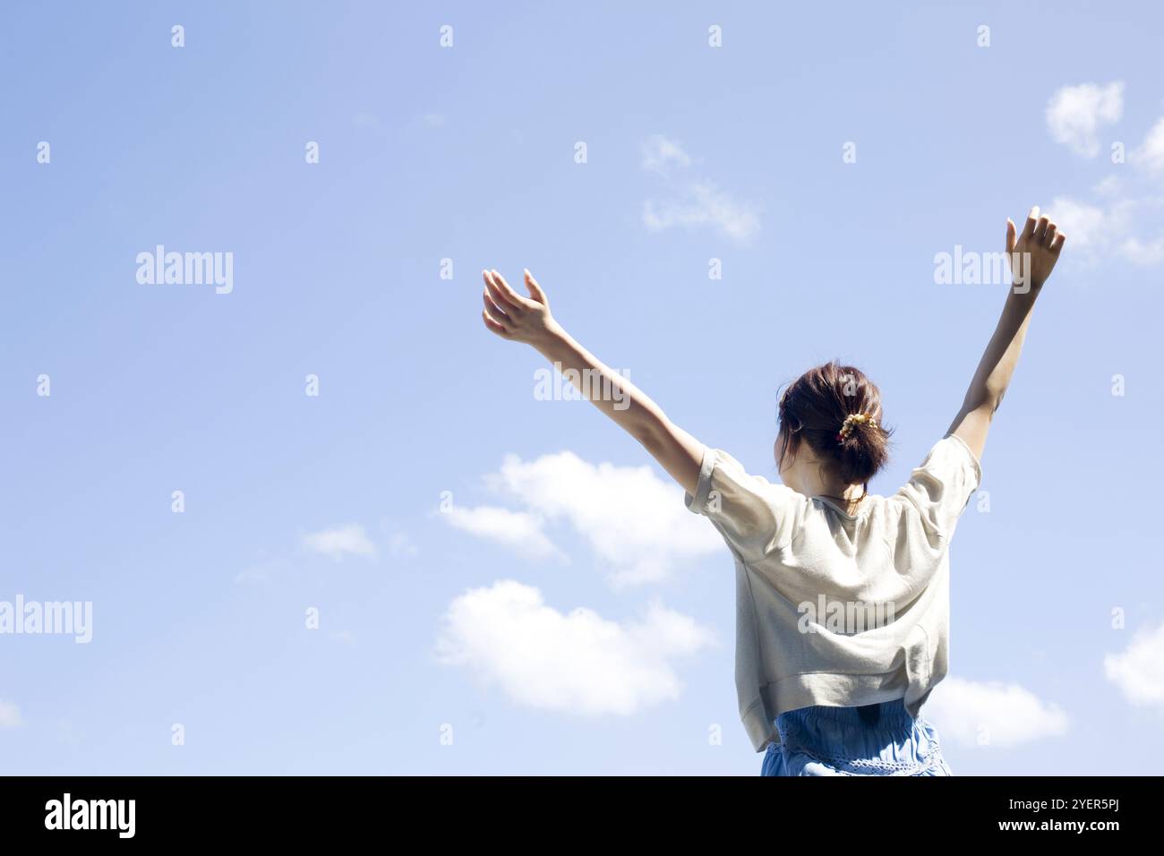 Back view woman raising hi-res stock photography and images - Alamy