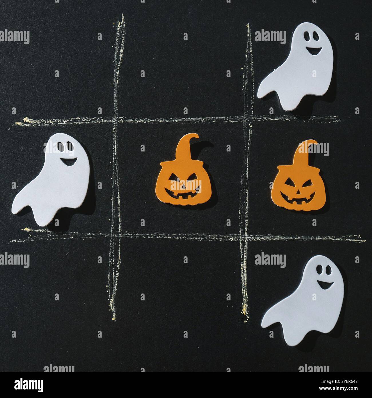 Creative tic tac toe game made of halloween decorations. Ghost bat ...