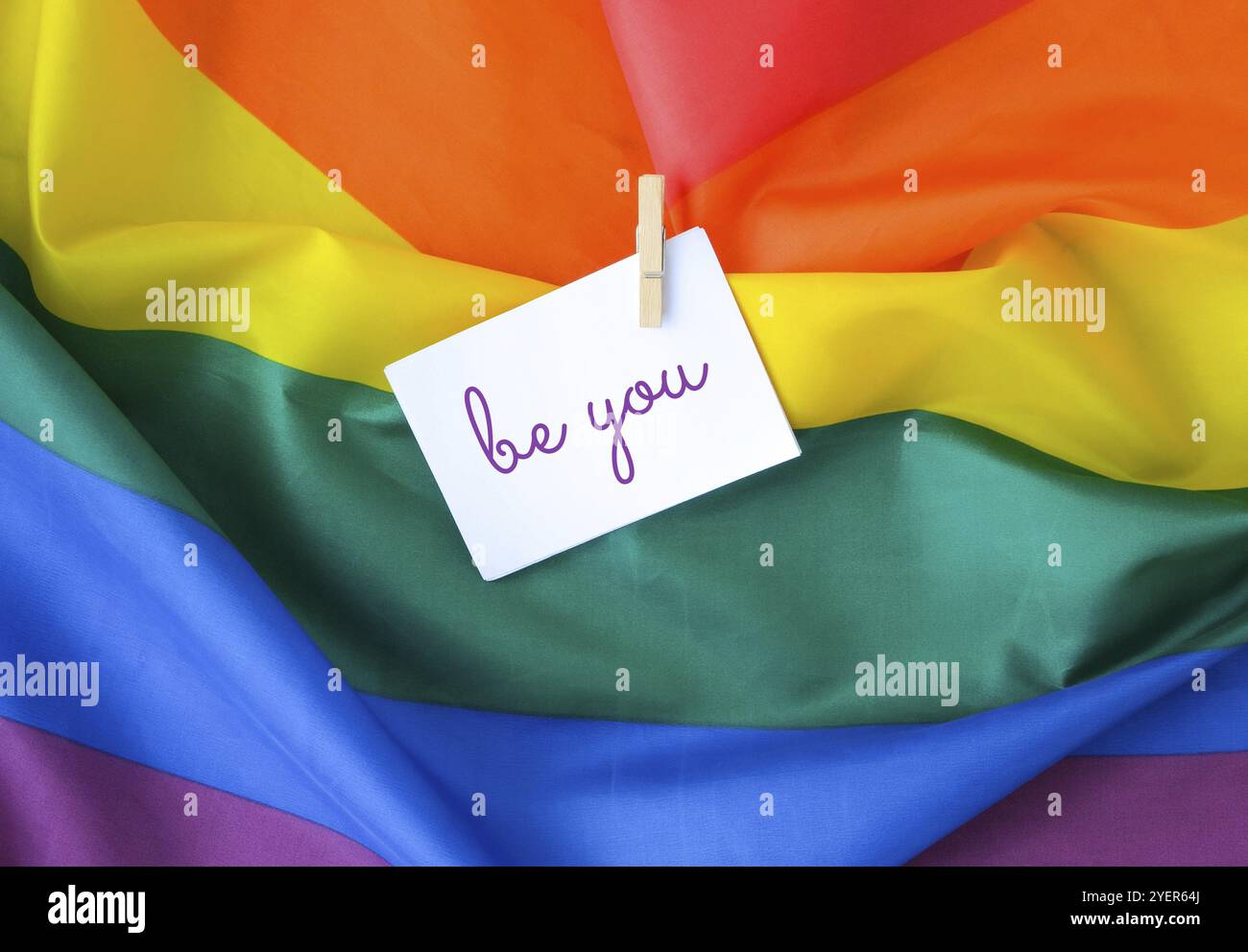 Rainbow flag with text BE YOU message on paper note. Rainbow lgbtq flag ...