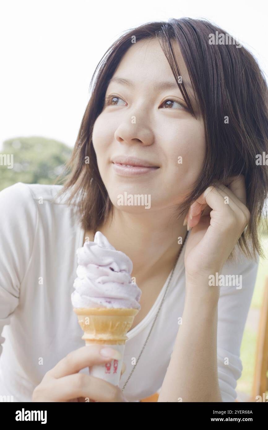 Woman eating ice cream Stock Photo - Alamy