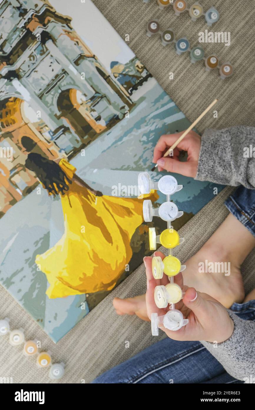 Female hands coloring canvas Picture by numbers girl Triumphal Arch ...