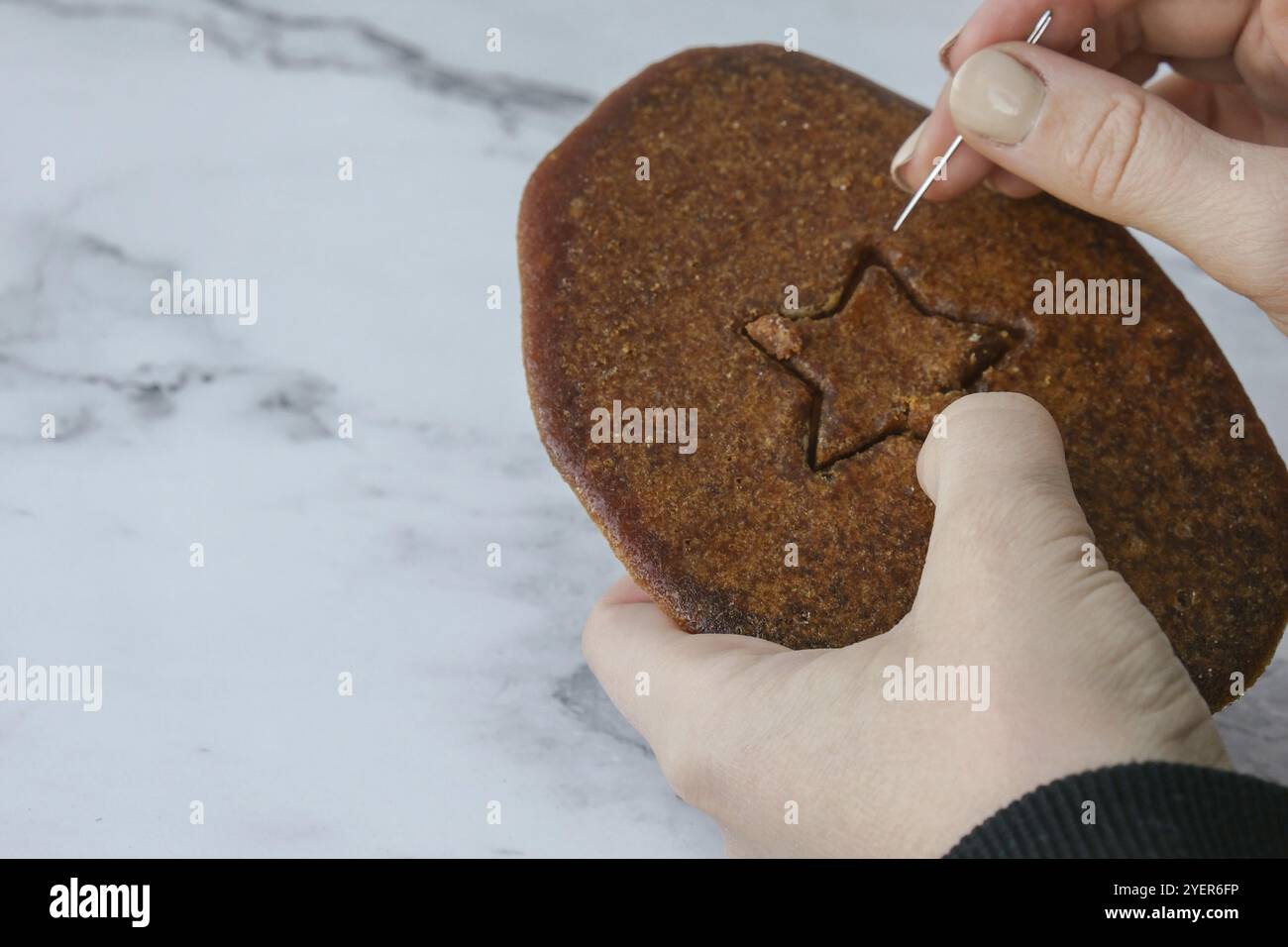 Playing Korean Dalgona or Ppopgi honeycomb candy from Squid Game ...