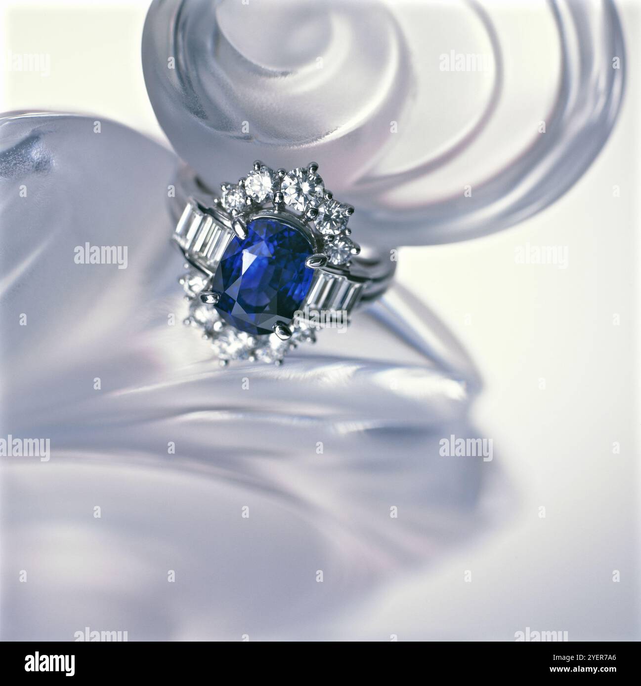 Sapphire ring placed on top of a perfume bottle Stock Photo - Alamy