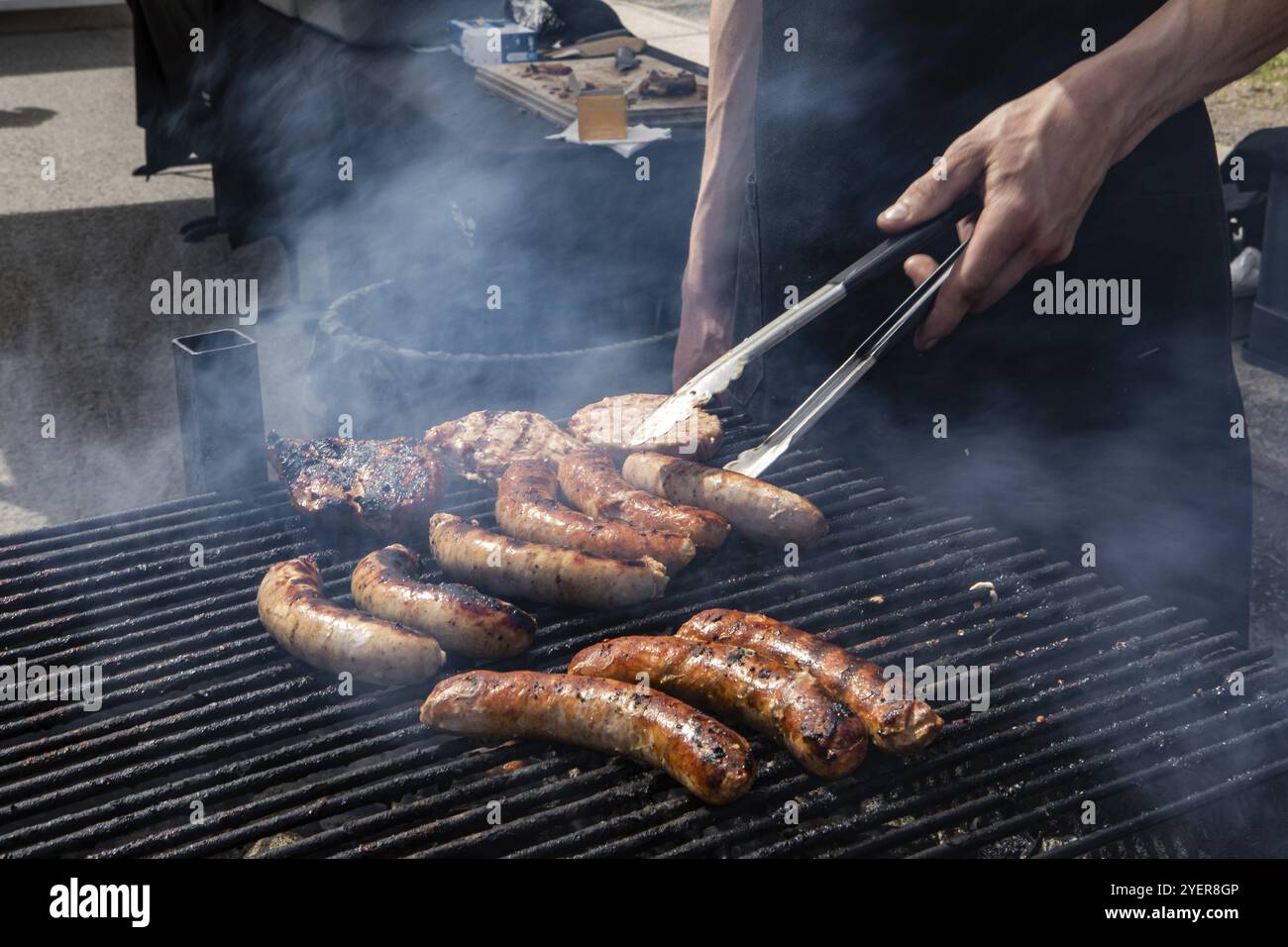 Person using tongs turn over hi-res stock photography and images - Alamy