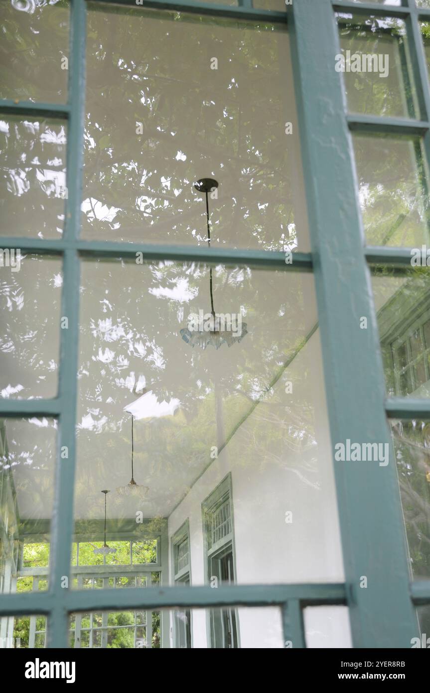Electric light seen through window in Western-style house Stock Photo ...