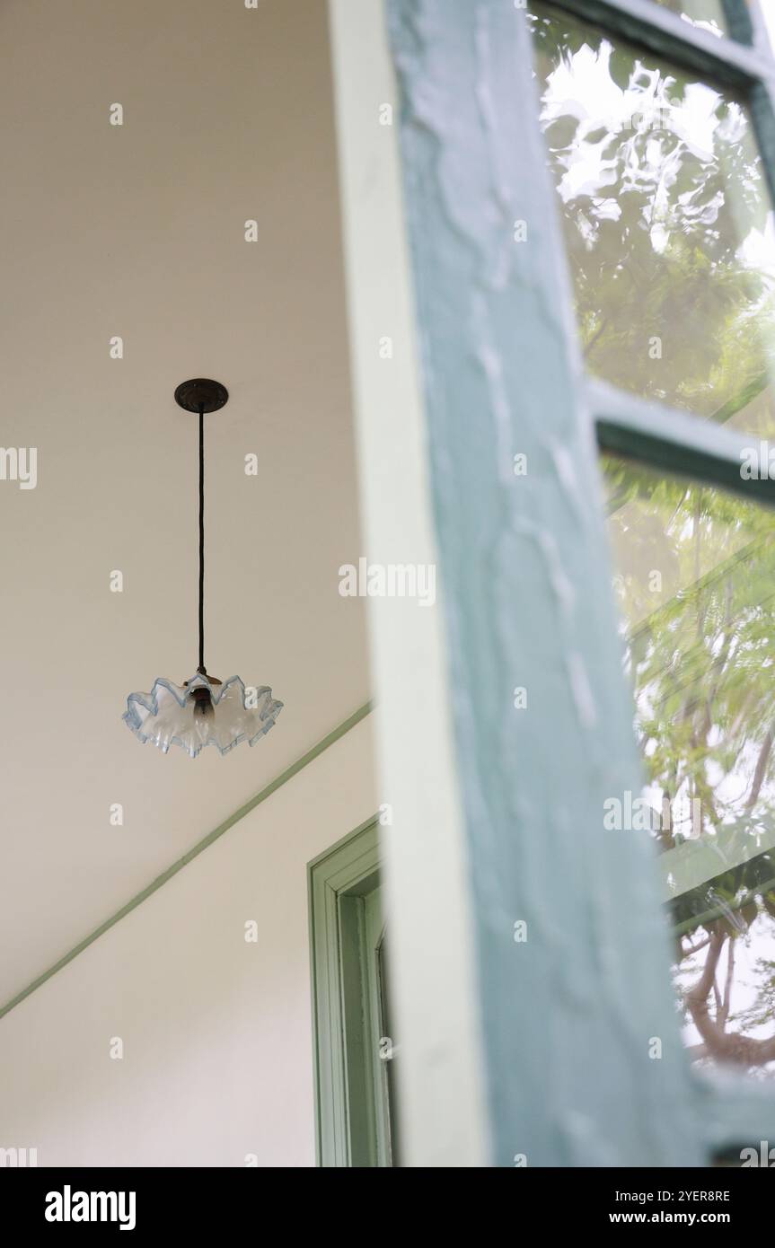 Electric light seen through window in Western-style house Stock Photo ...