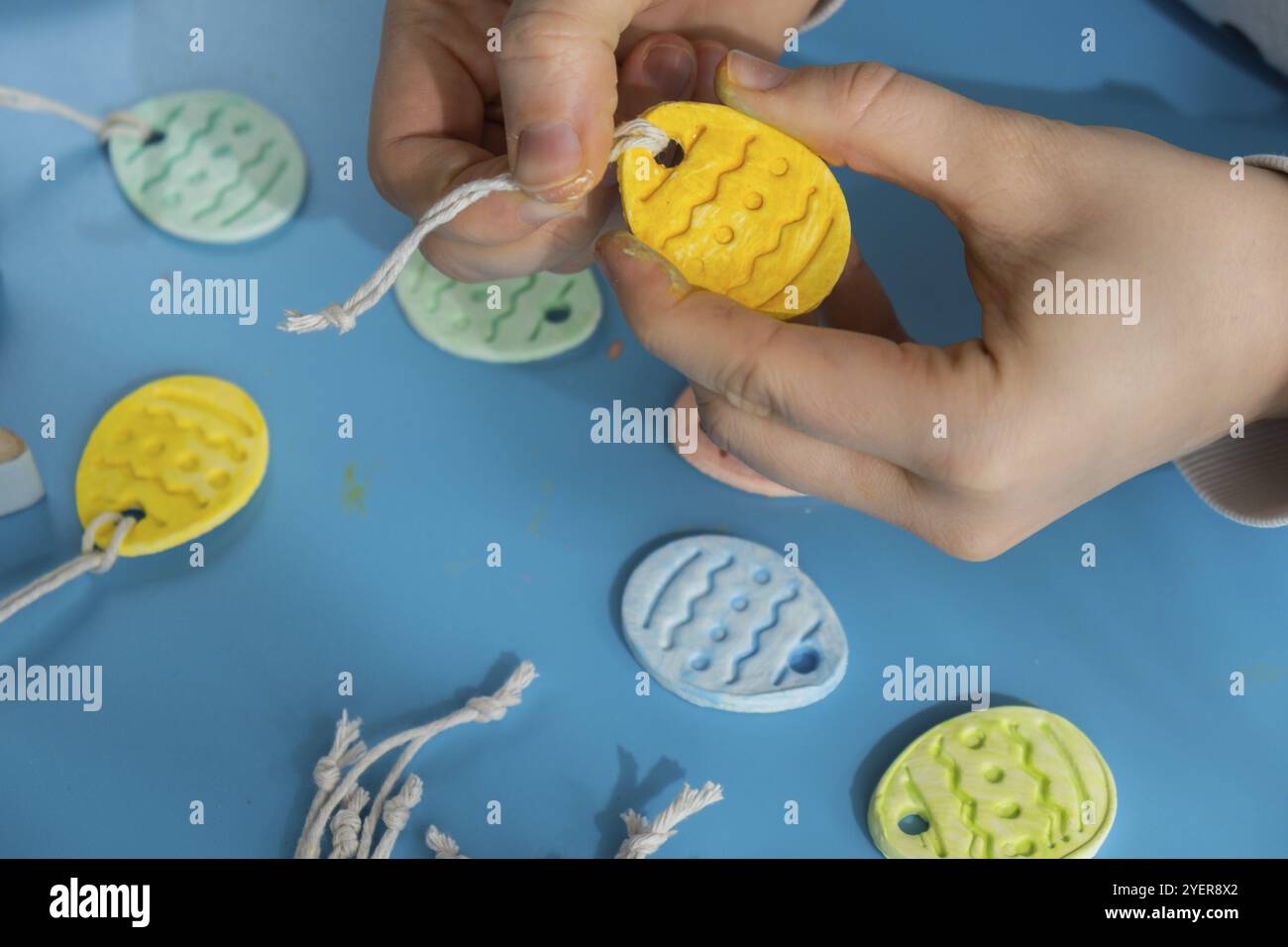 Unrecognizable artist do it yourself air dry clay crafts for Easter ...