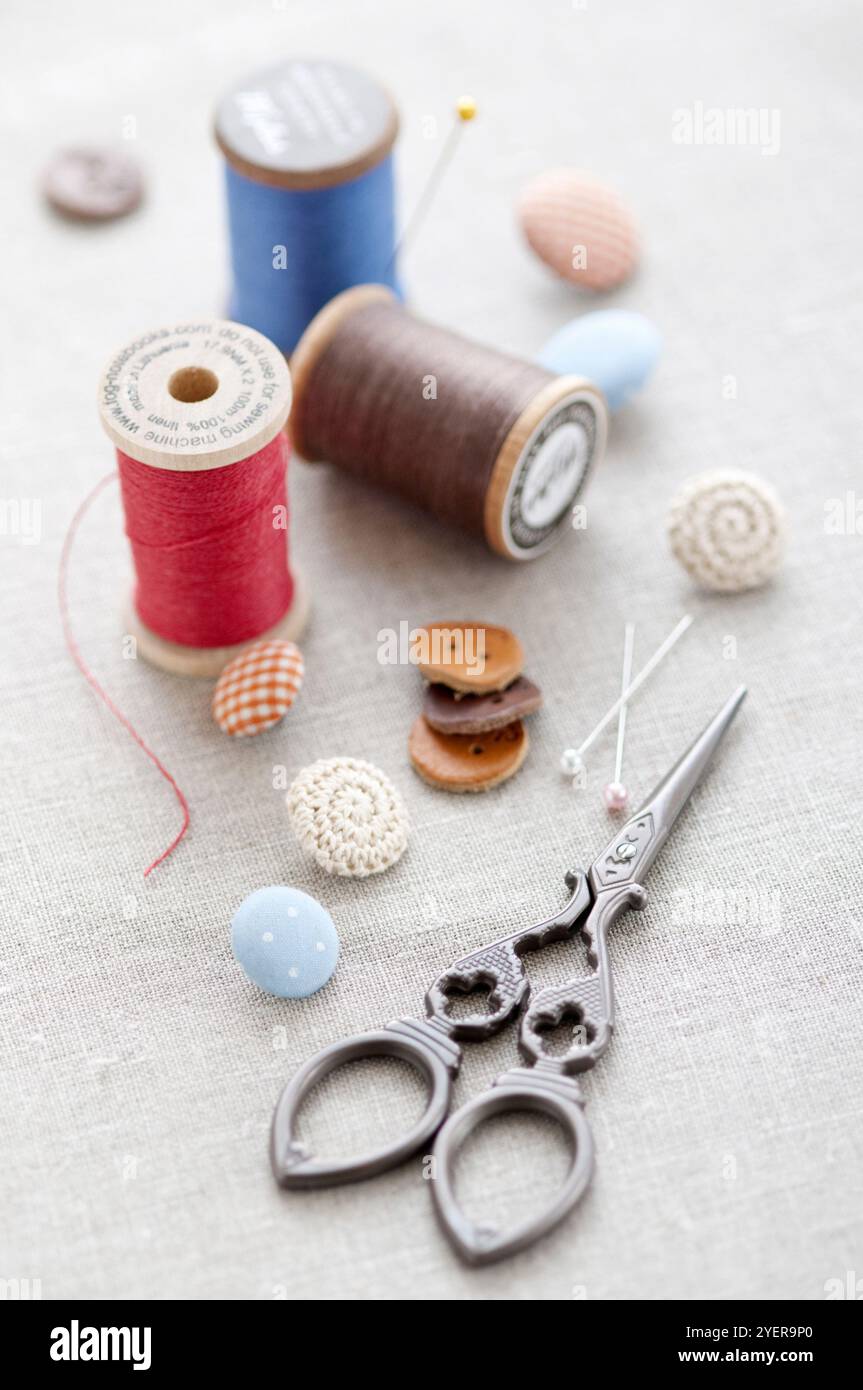 Buttons, thread and scissors Stock Photo - Alamy