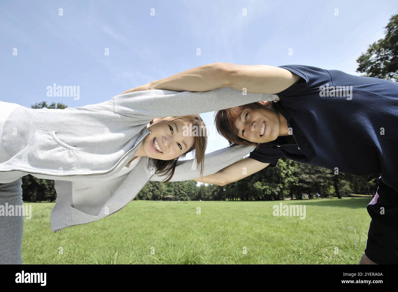 Man and woman doing preparatory exercise Stock Photo - Alamy