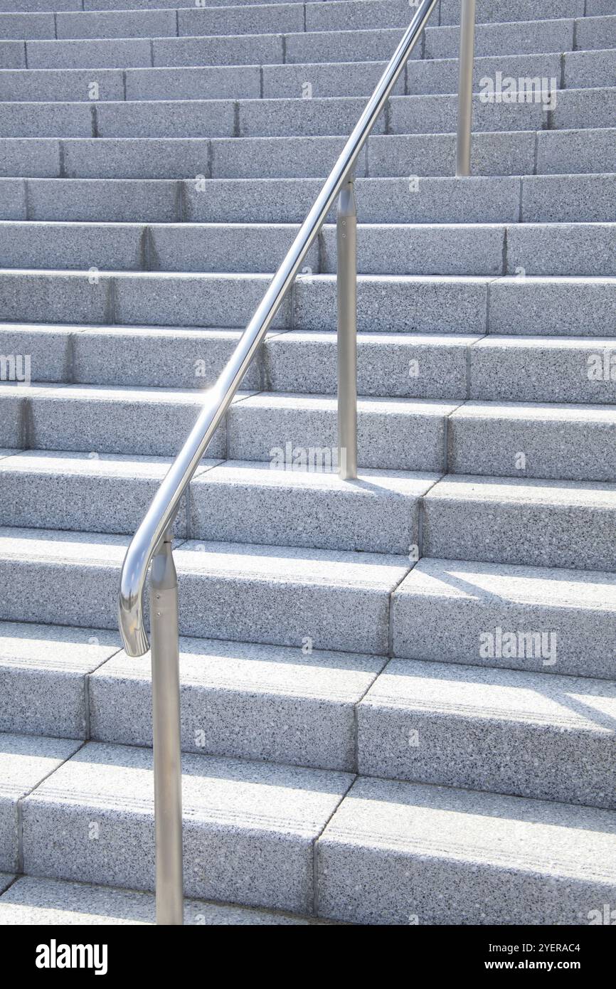 Stone staircase and stainless steel pipe handrail Stock Photo - Alamy
