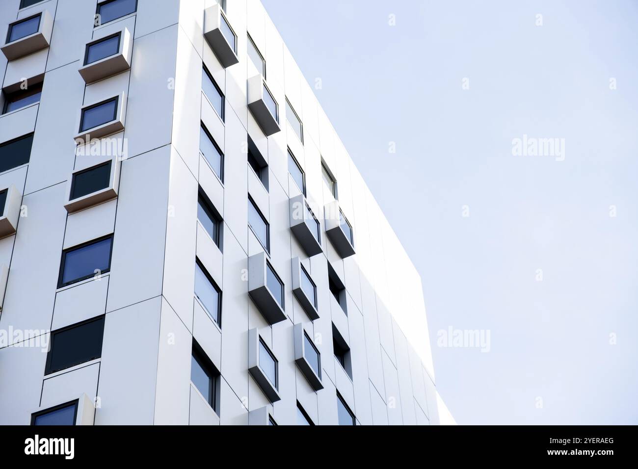 Modern white building with square windows. Multistory apartment ...