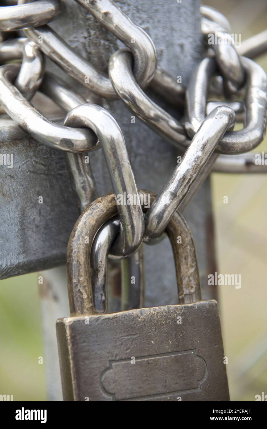 Heavy-duty locks on steel railings Stock Photo - Alamy