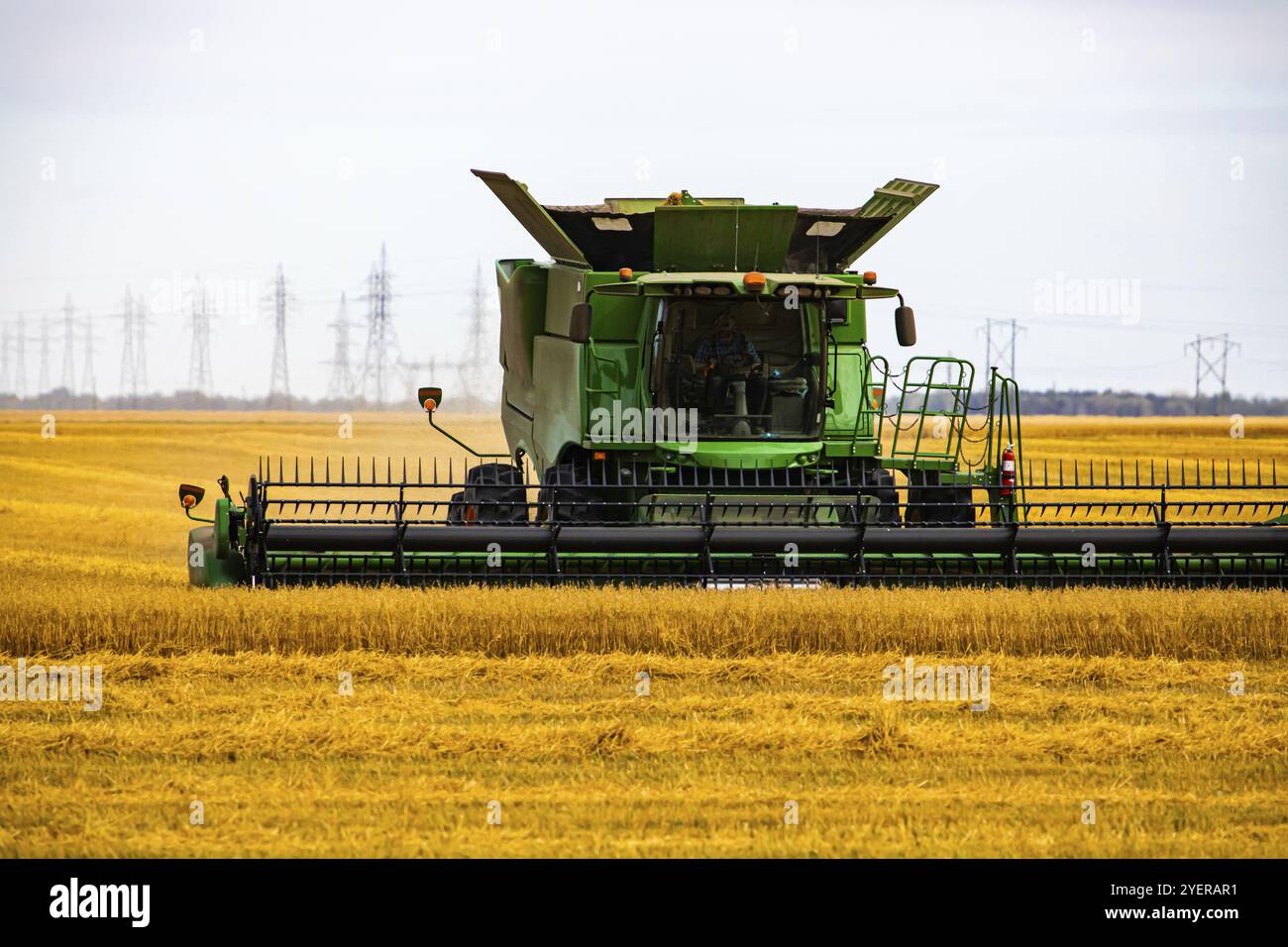 A large modern combine harvester is seen from the front, multi function ...