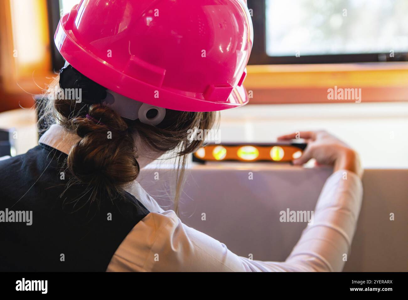 Construction quality control. close up rear view of a woman architect ...