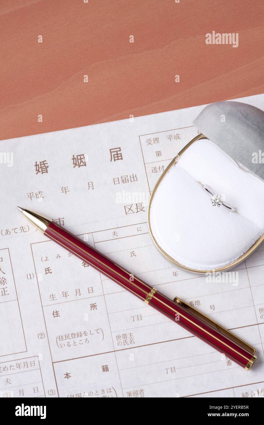 Marriage registers and rings Stock Photo - Alamy