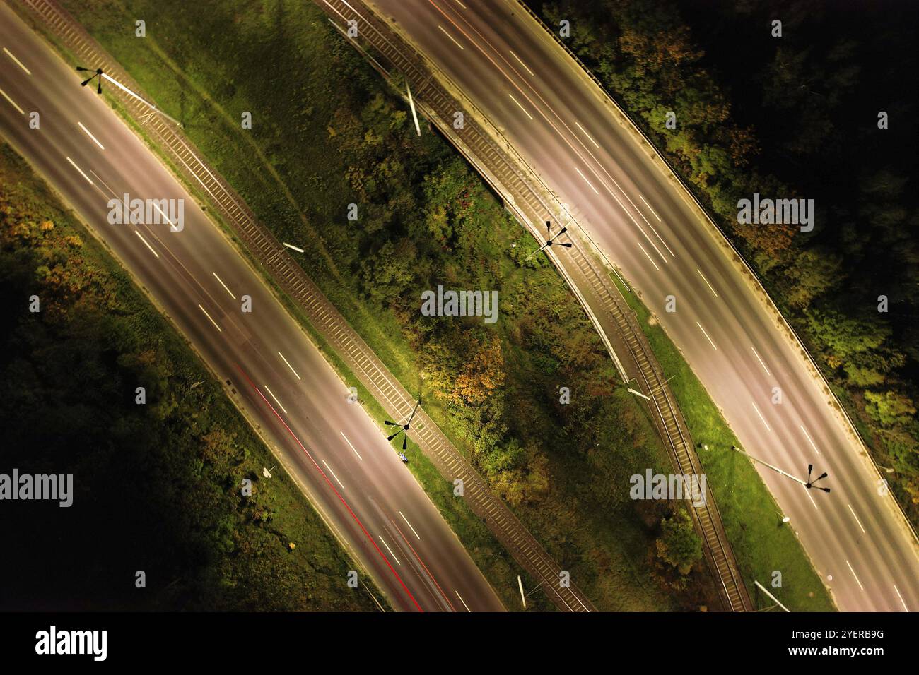 Top down view to road. Romantic night aerial photo of cars traveling ...