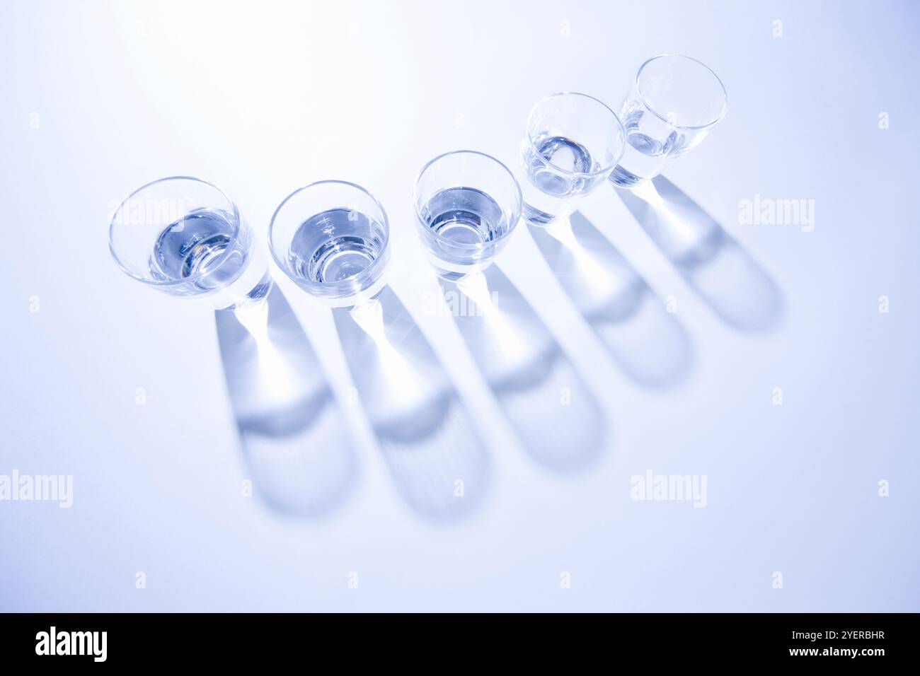Five glasses filled with water Stock Photo - Alamy