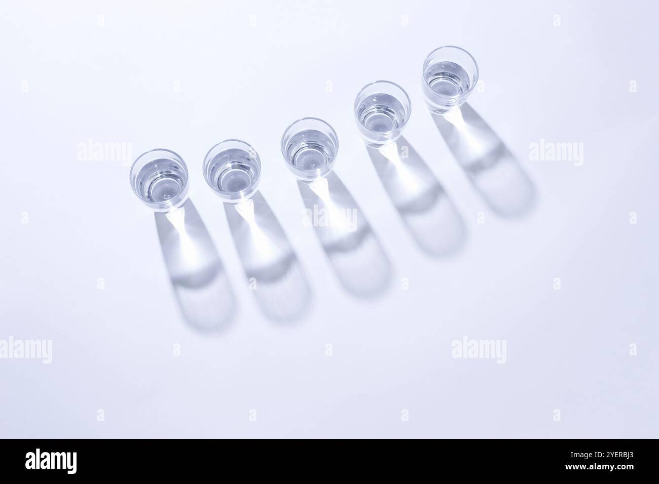 Five glasses filled with water Stock Photo - Alamy