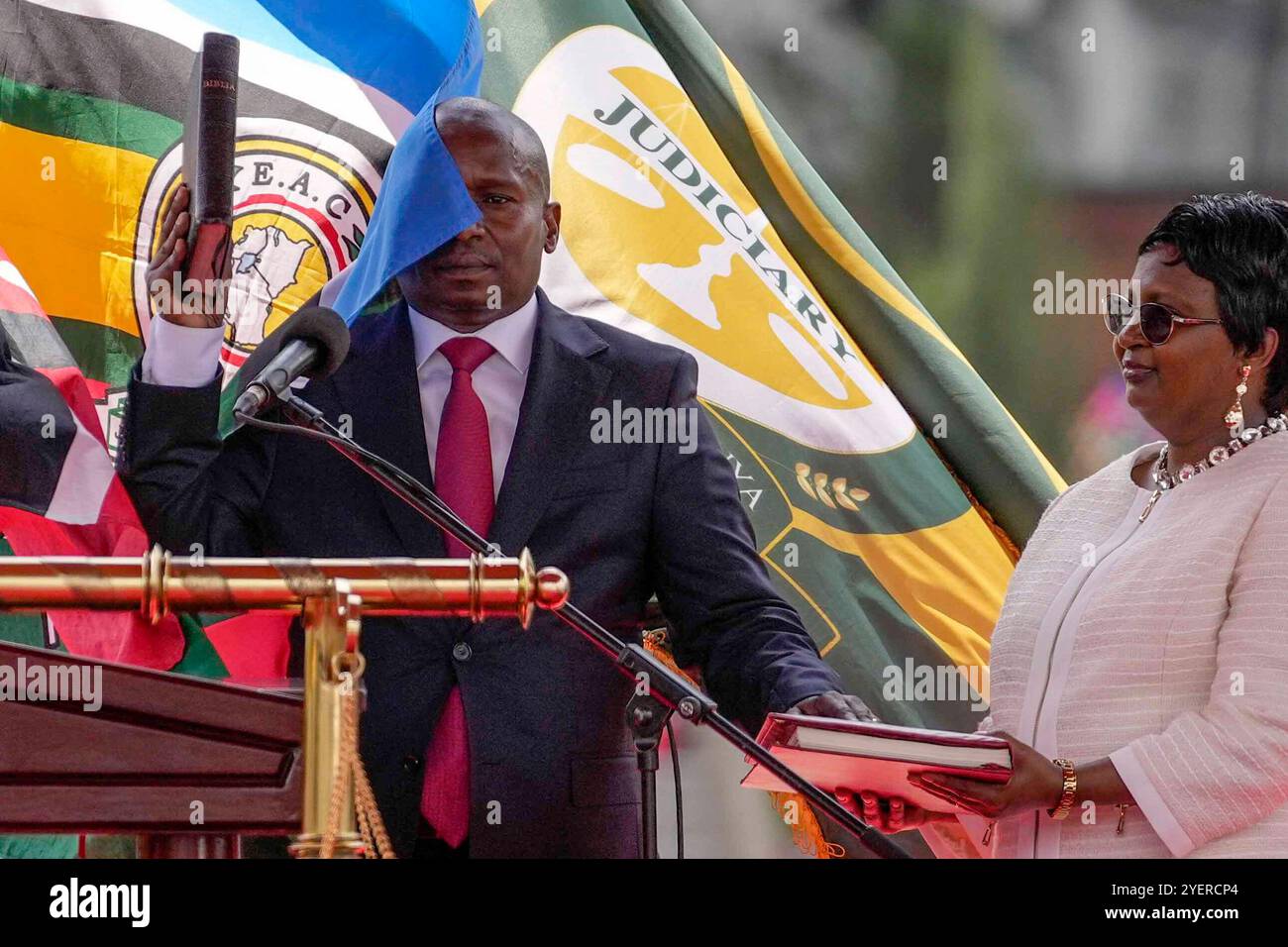 Kenya's new Deputy President Kithure Kindiki, left, is sworn into ...