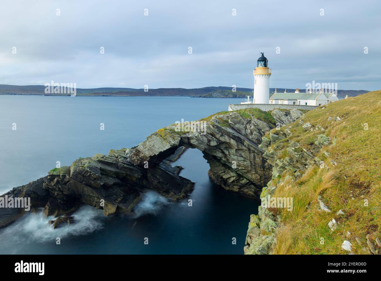 Isle of Bressay Lighthouse and natural arch, Shetland Isles Stock Photo ...