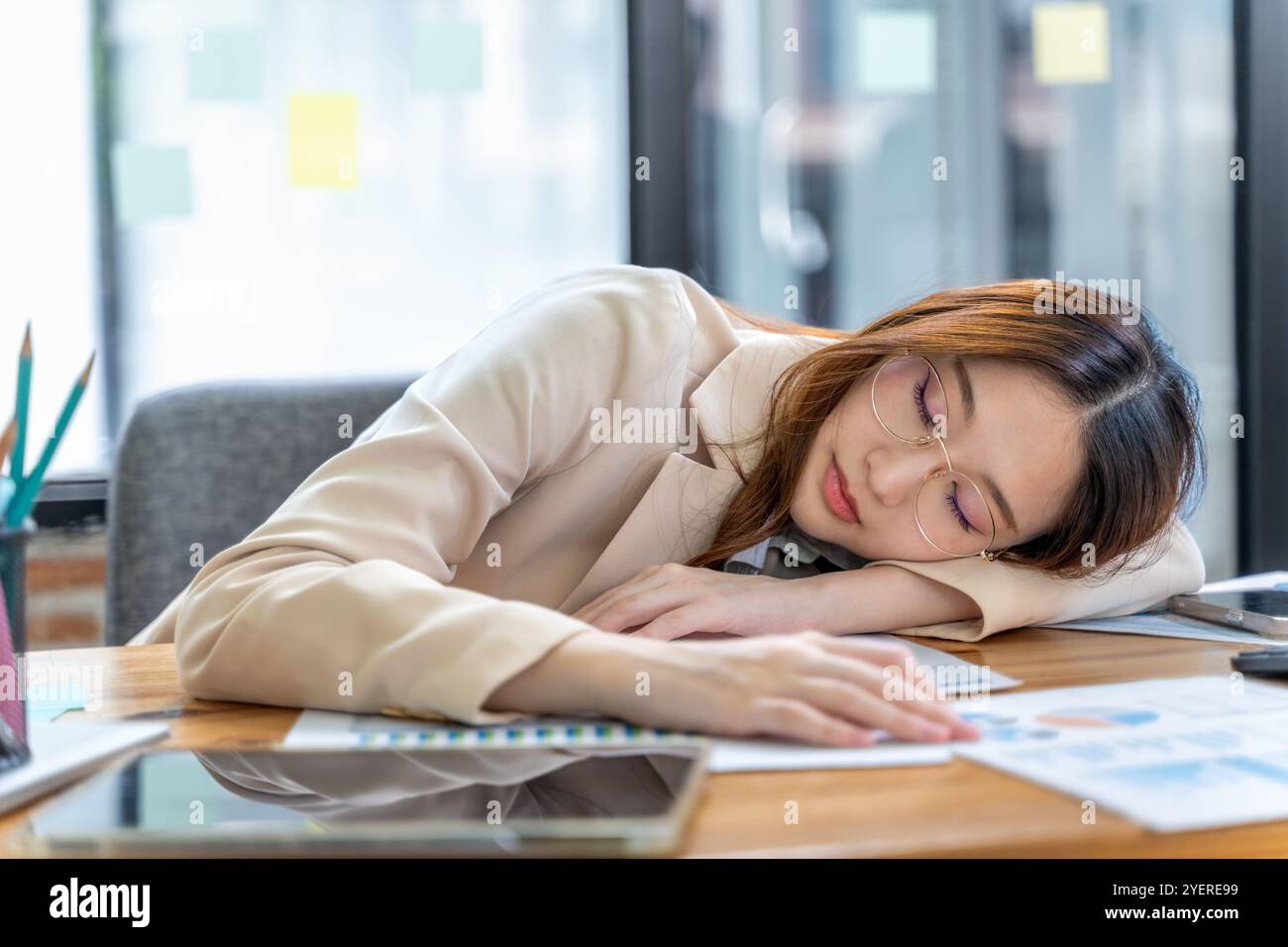 Woman with head down on desk hi-res stock photography and images - Alamy