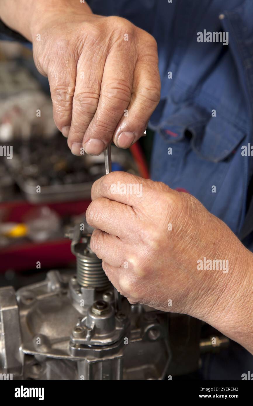 Automotive component assembly work Stock Photo - Alamy