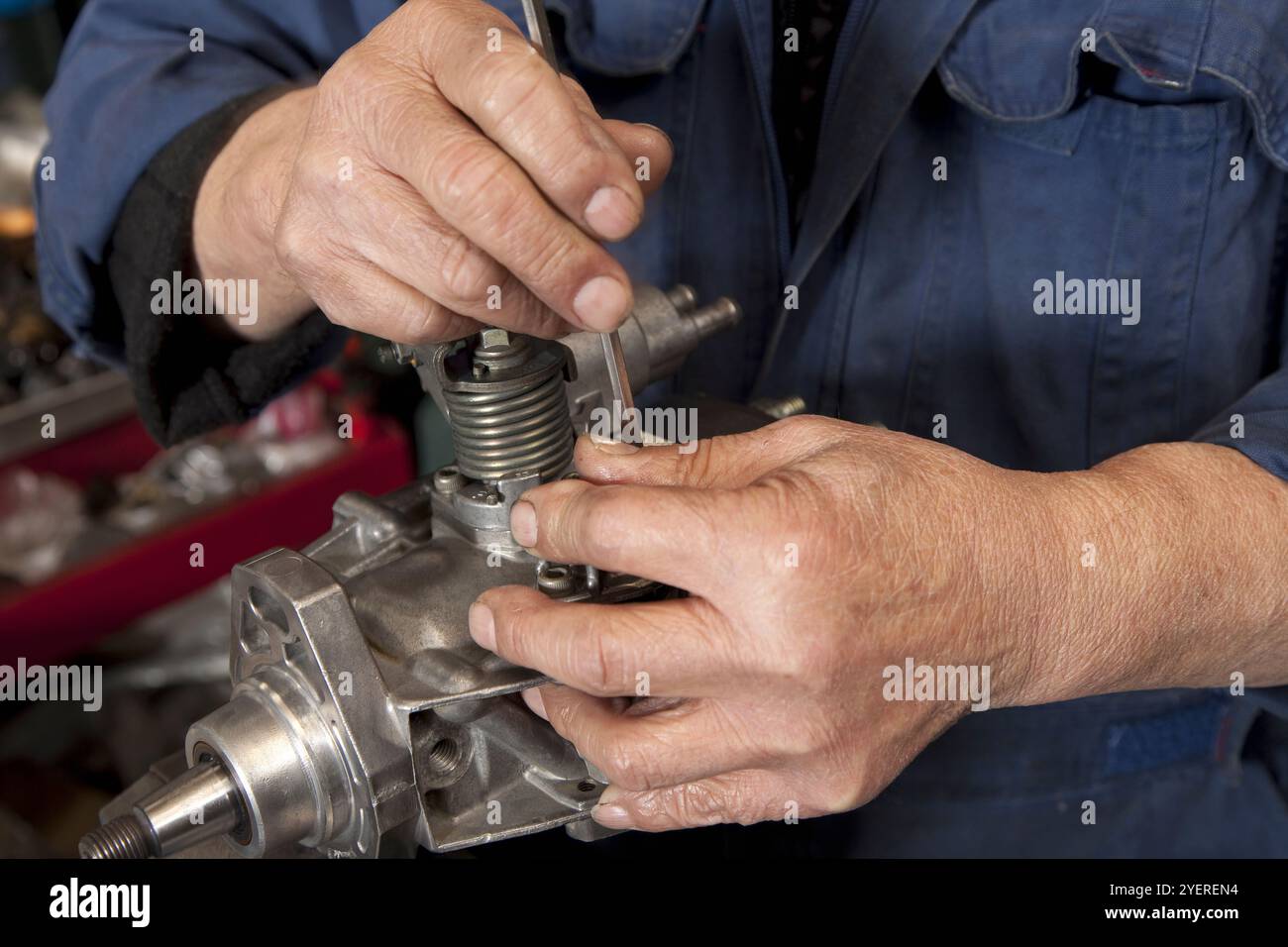 Automotive component assembly work Stock Photo - Alamy