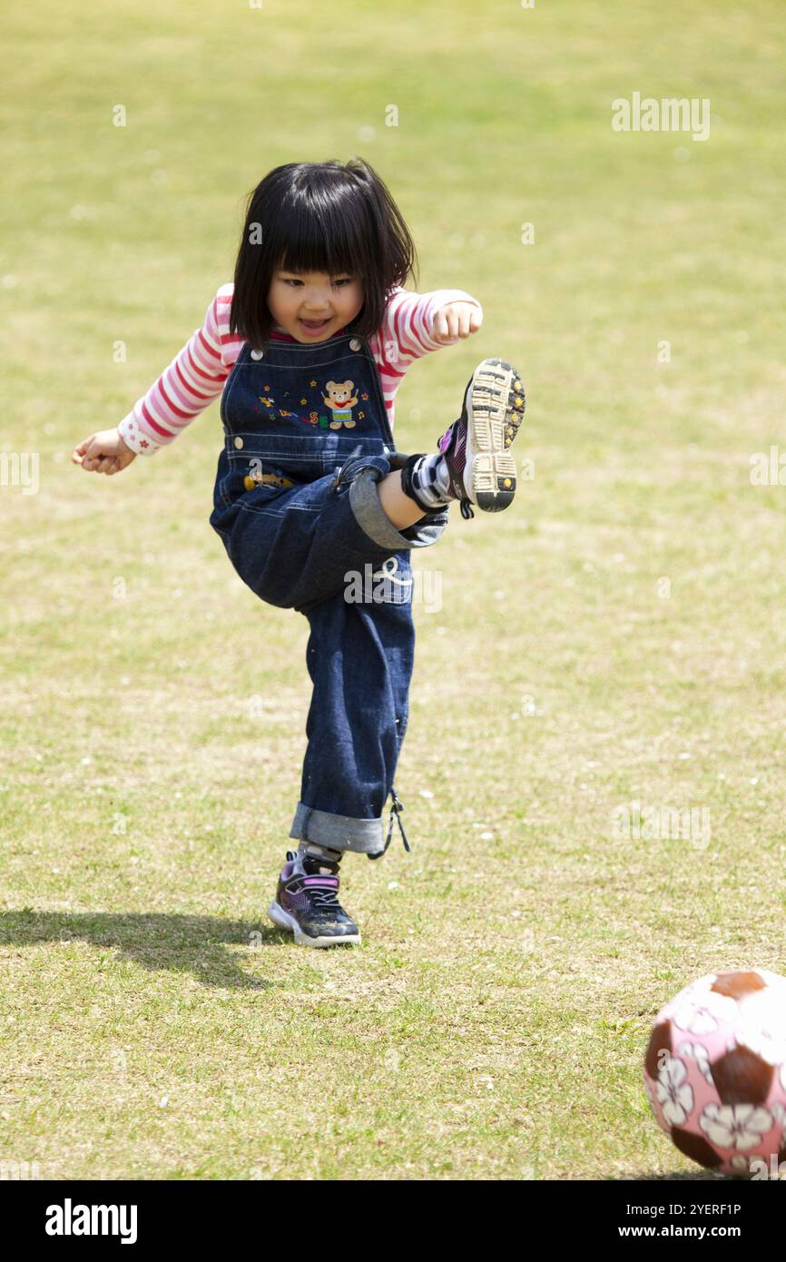 Girls playing ball Stock Photo - Alamy