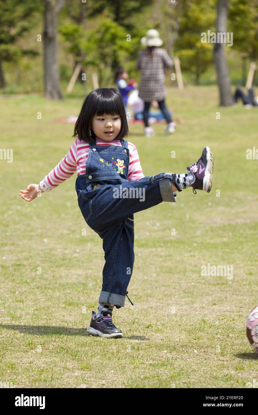 Smiling children playing outdoors Stock Photo - Alamy