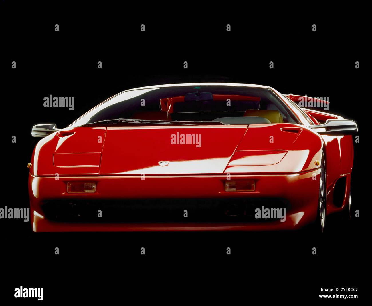 Front view of red supercar shot against black background Stock Photo ...