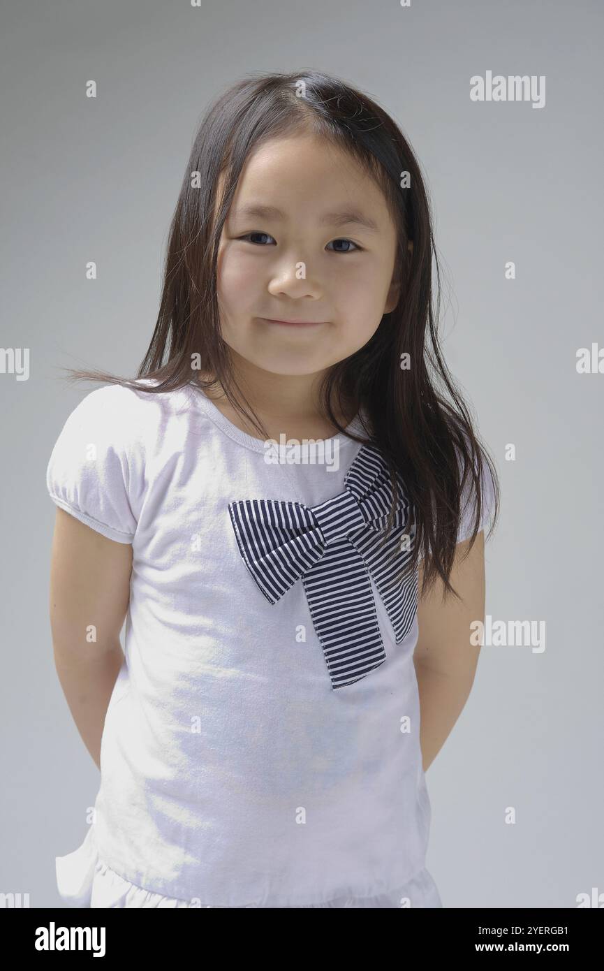 Six-year-old smiling girl upper body Stock Photo - Alamy