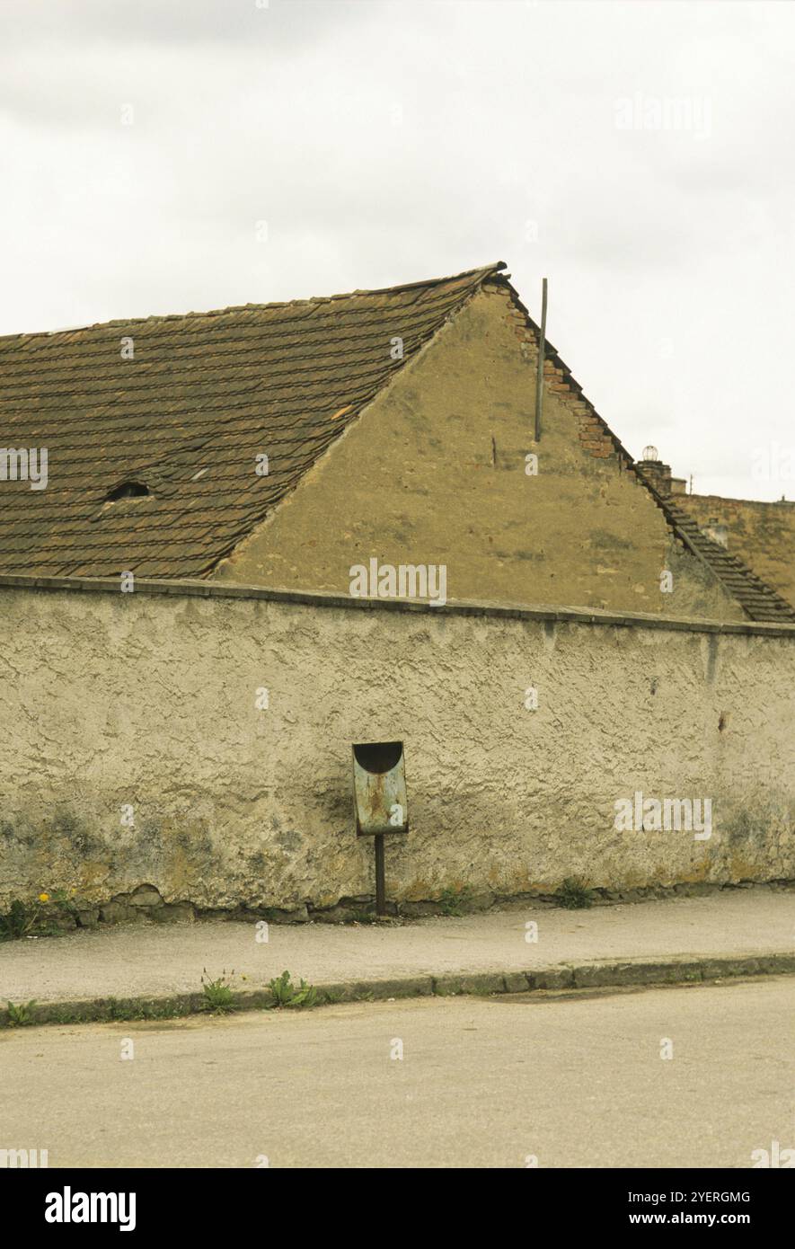Triangular roof and earthen wall Stock Photo - Alamy