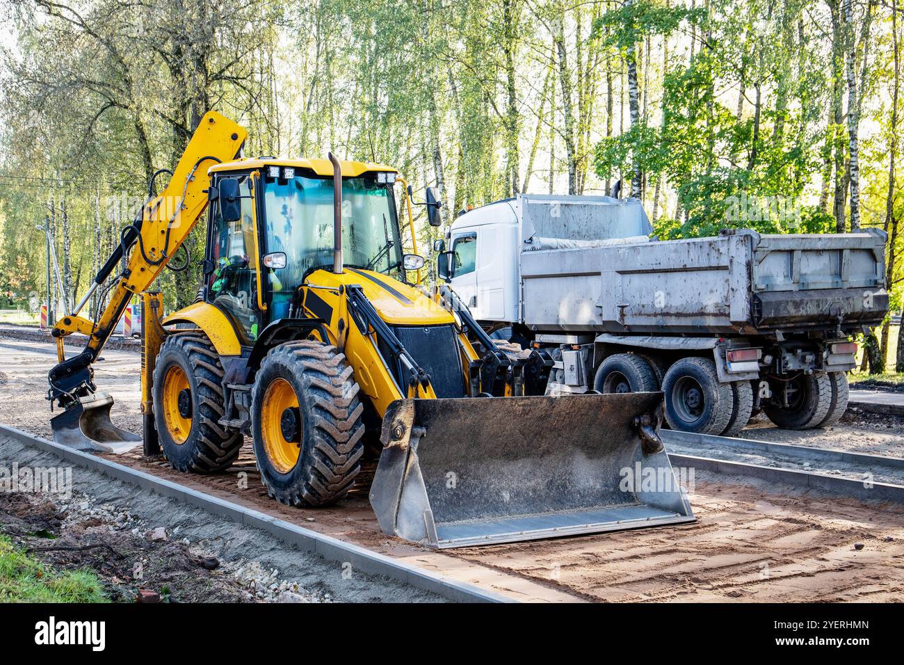 Road construction construction equipment. Bucket tractor and truck ...