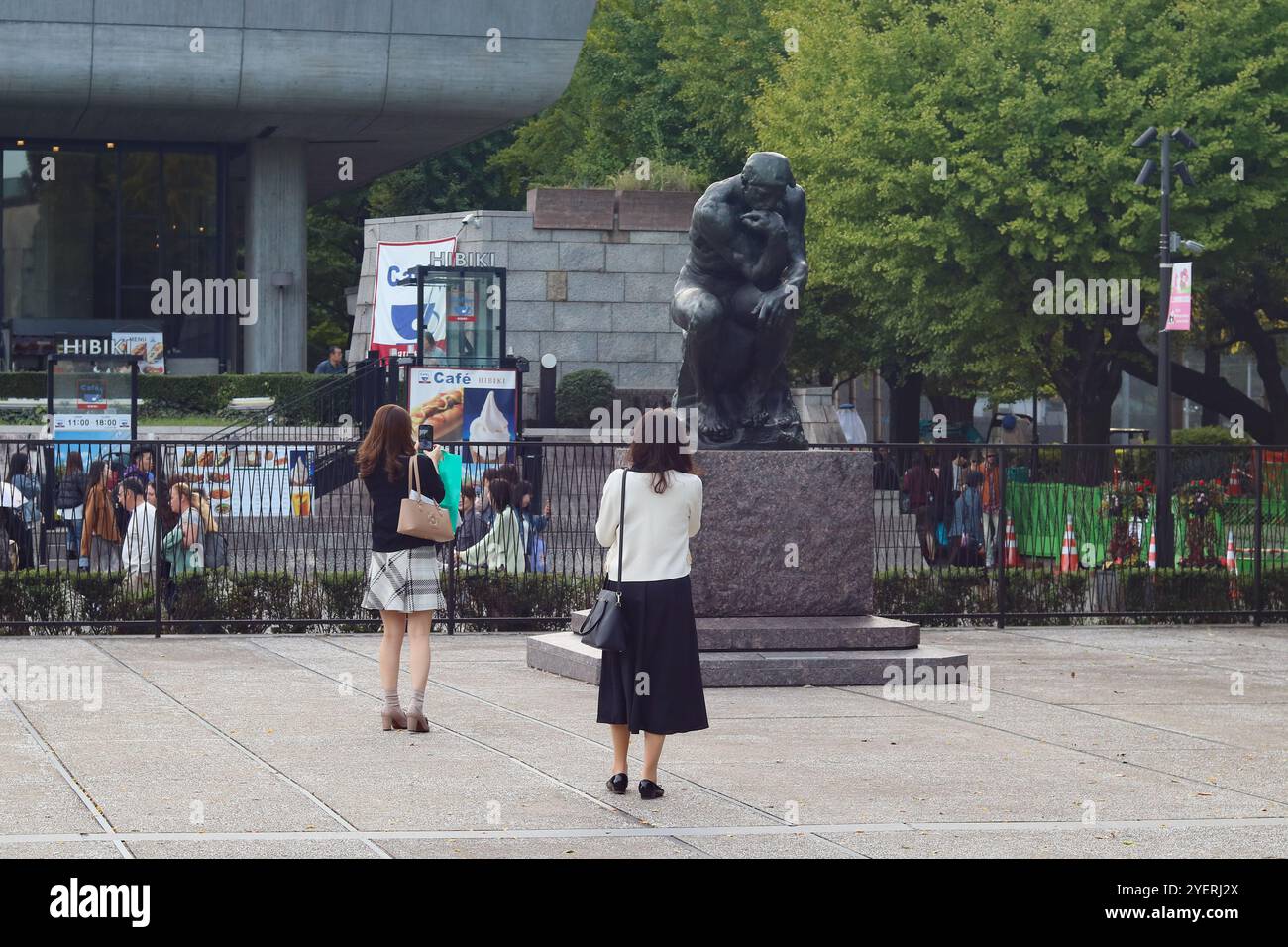 TOKYO, JAPAN - October 31, 2024: Visitors taking photos of Rodin's The ...