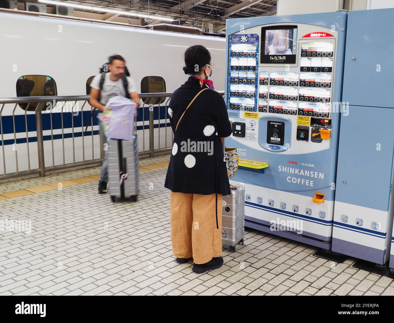 TOKYO, JAPAN - October 29, 2024: Passenger buying drink from shinkansen ...