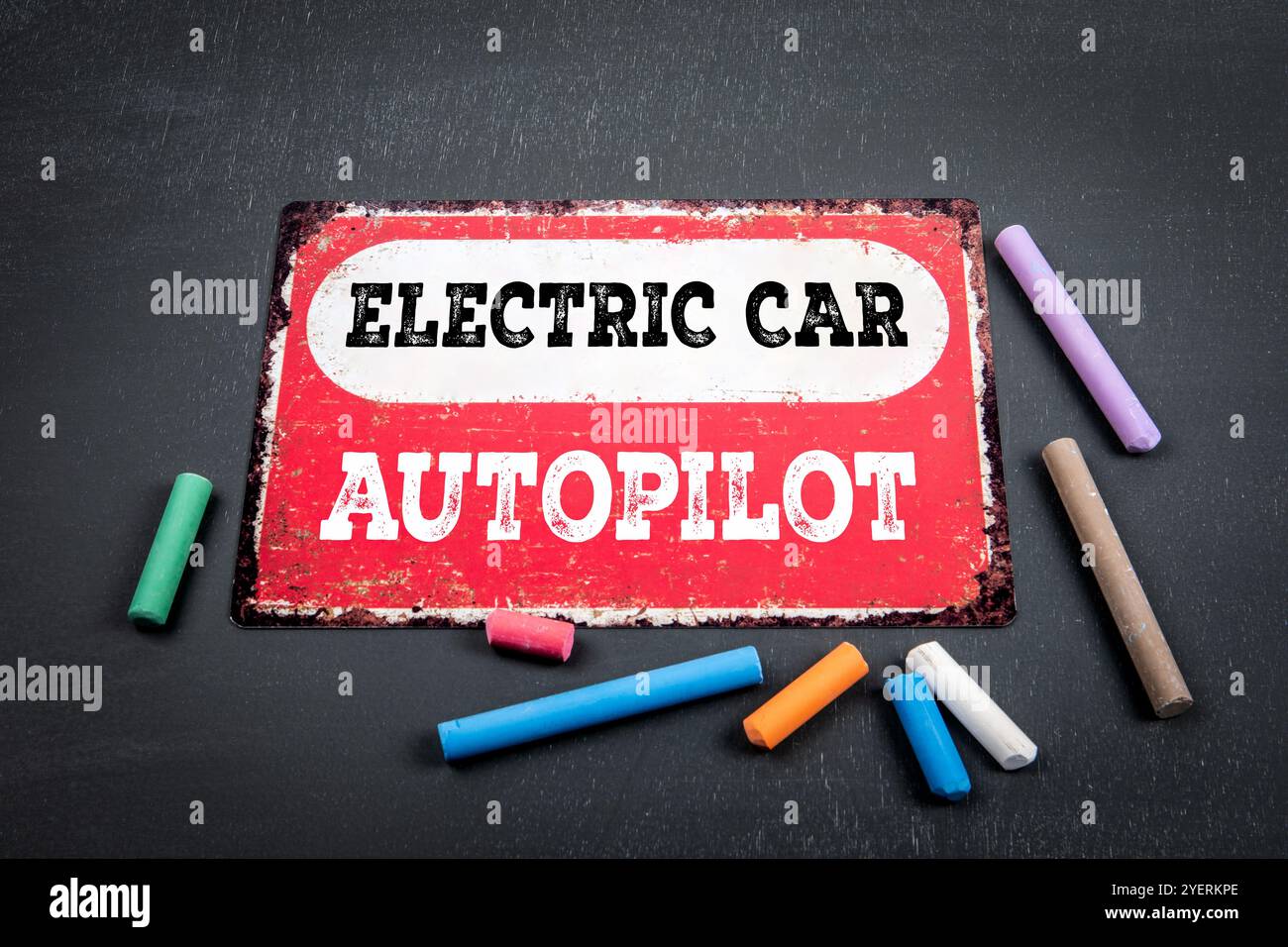Autopilot. Sign with text and colored pieces of chalk on a dark ...