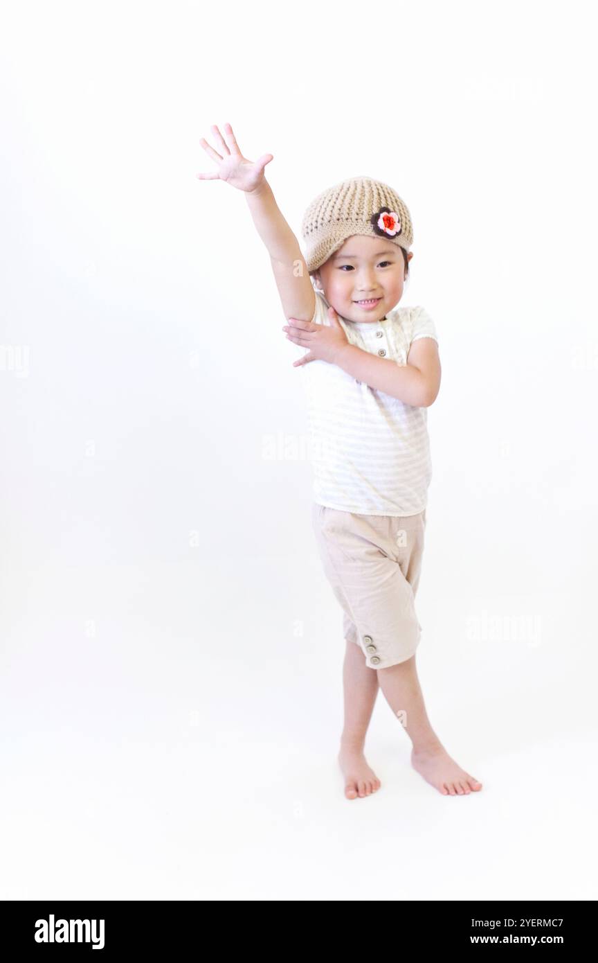 Girl raising her hand Stock Photo - Alamy