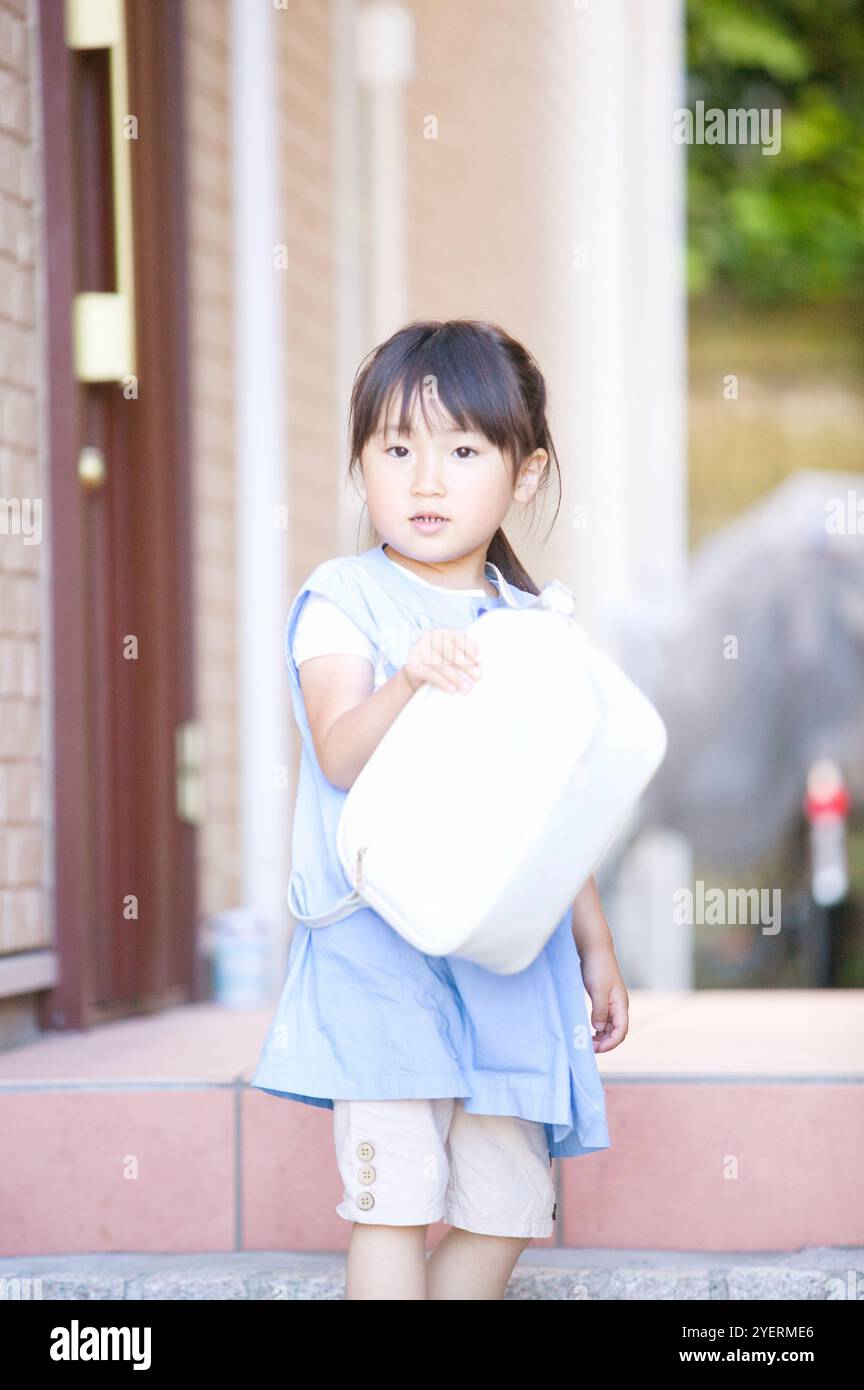 Girl going to kindergarten Stock Photo - Alamy