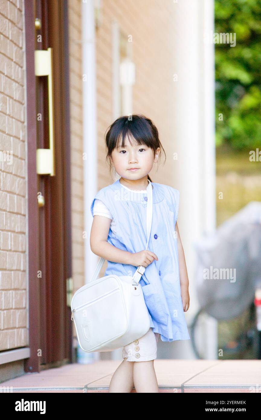 Girl going to kindergarten Stock Photo - Alamy