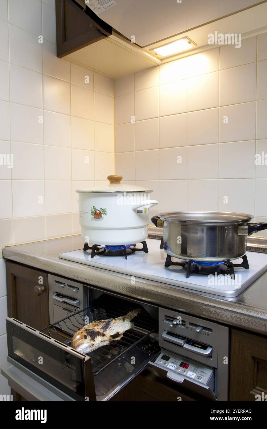 Cooking scene in the kitchen Stock Photo - Alamy