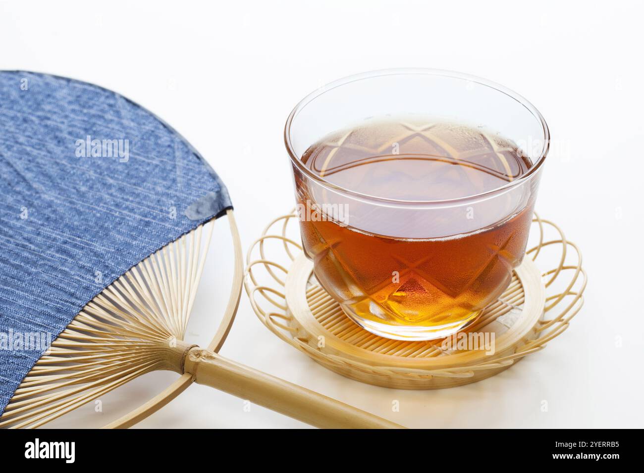 Barley tea in glassware and fan Stock Photo - Alamy
