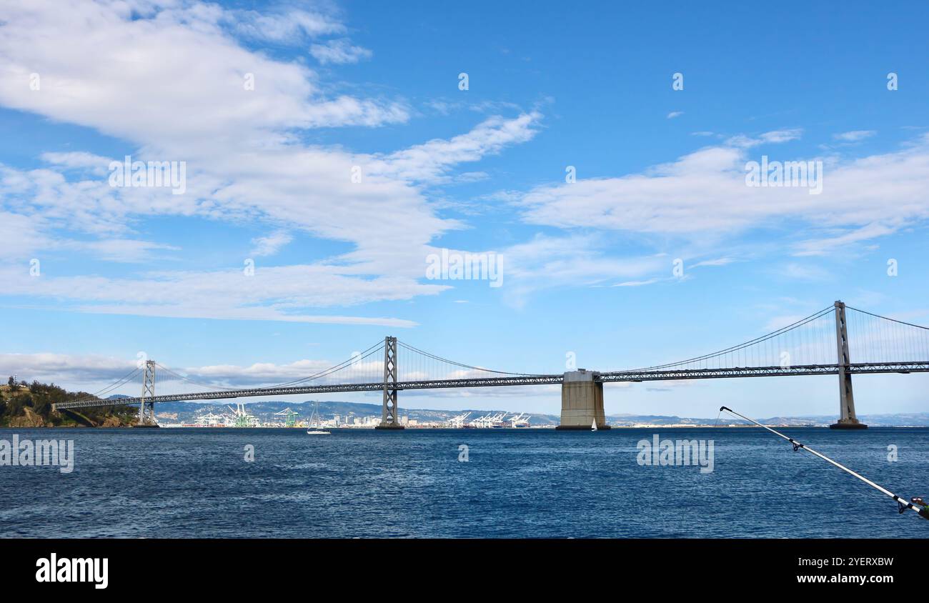 Rod and line fishing from Pier 7 with a landscape view of Bay Bridge ...
